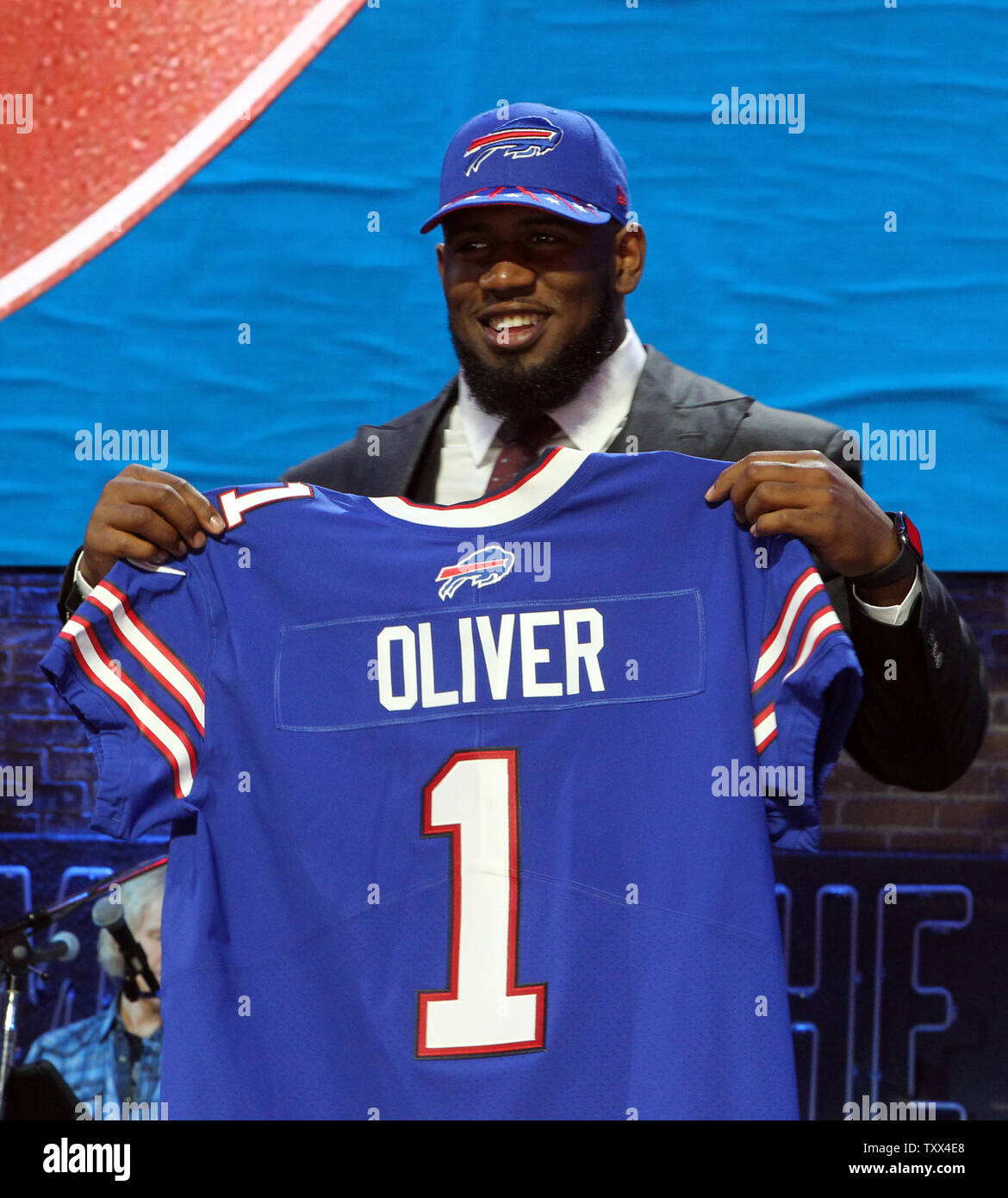 Ed Oliver from Houston holds up a jersey after being picked ninth over ...