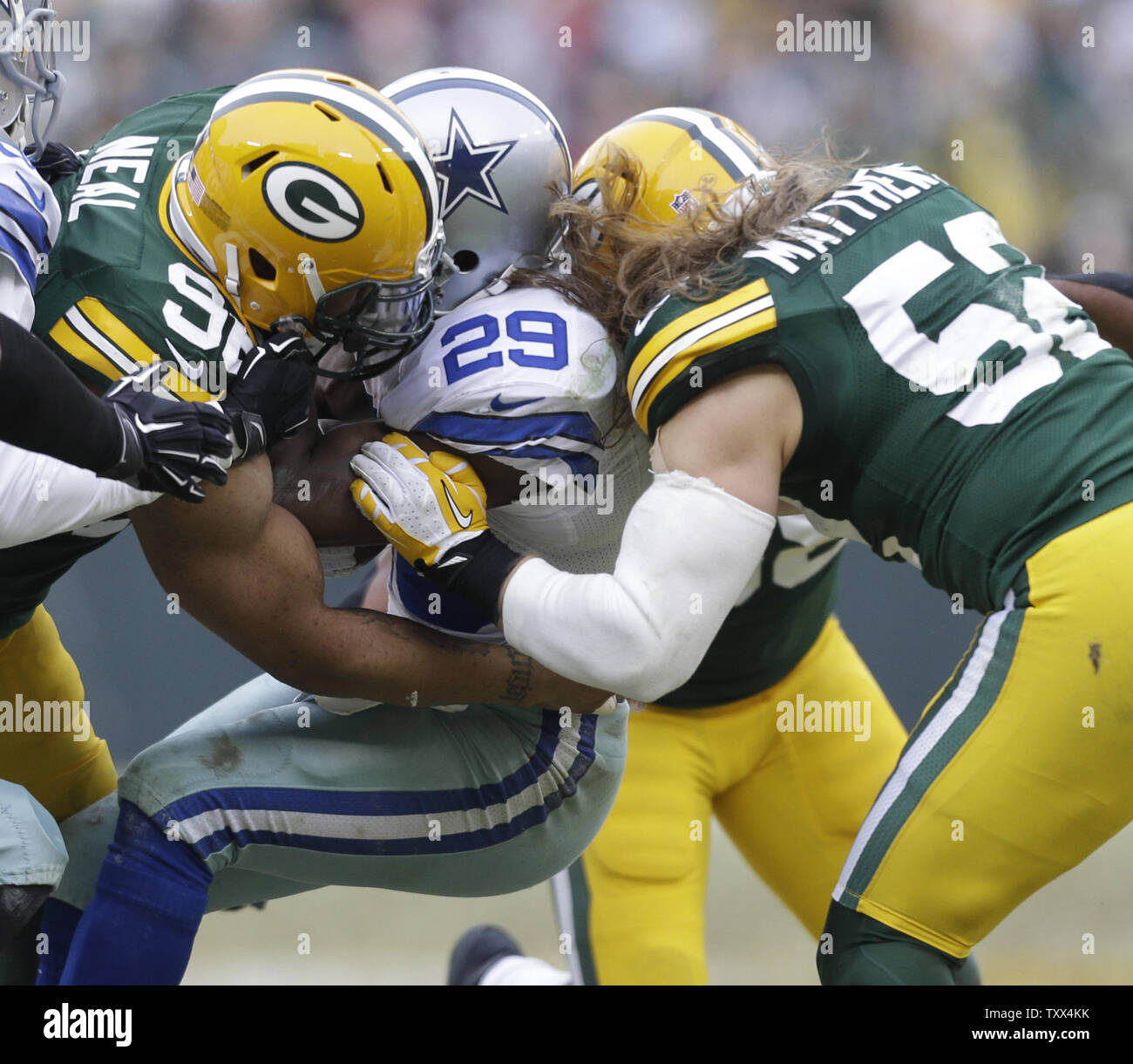 Green Bay Packers' Mike Neal (96) and Clay Matthews (52) make a hit on ...
