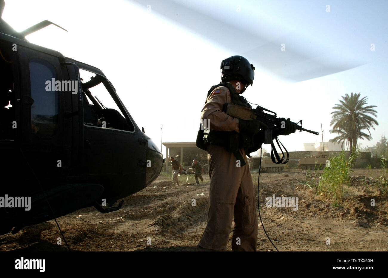 Crew Chief SPC Sam Simons provides security in a LZ, while injured ...