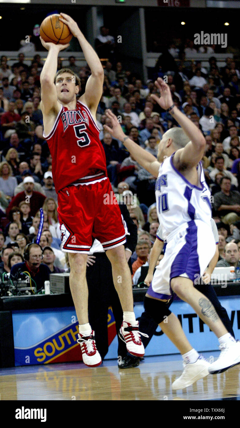 Andres Marcelo from the Chicago Bulls shoots over Mike Bibby the ...