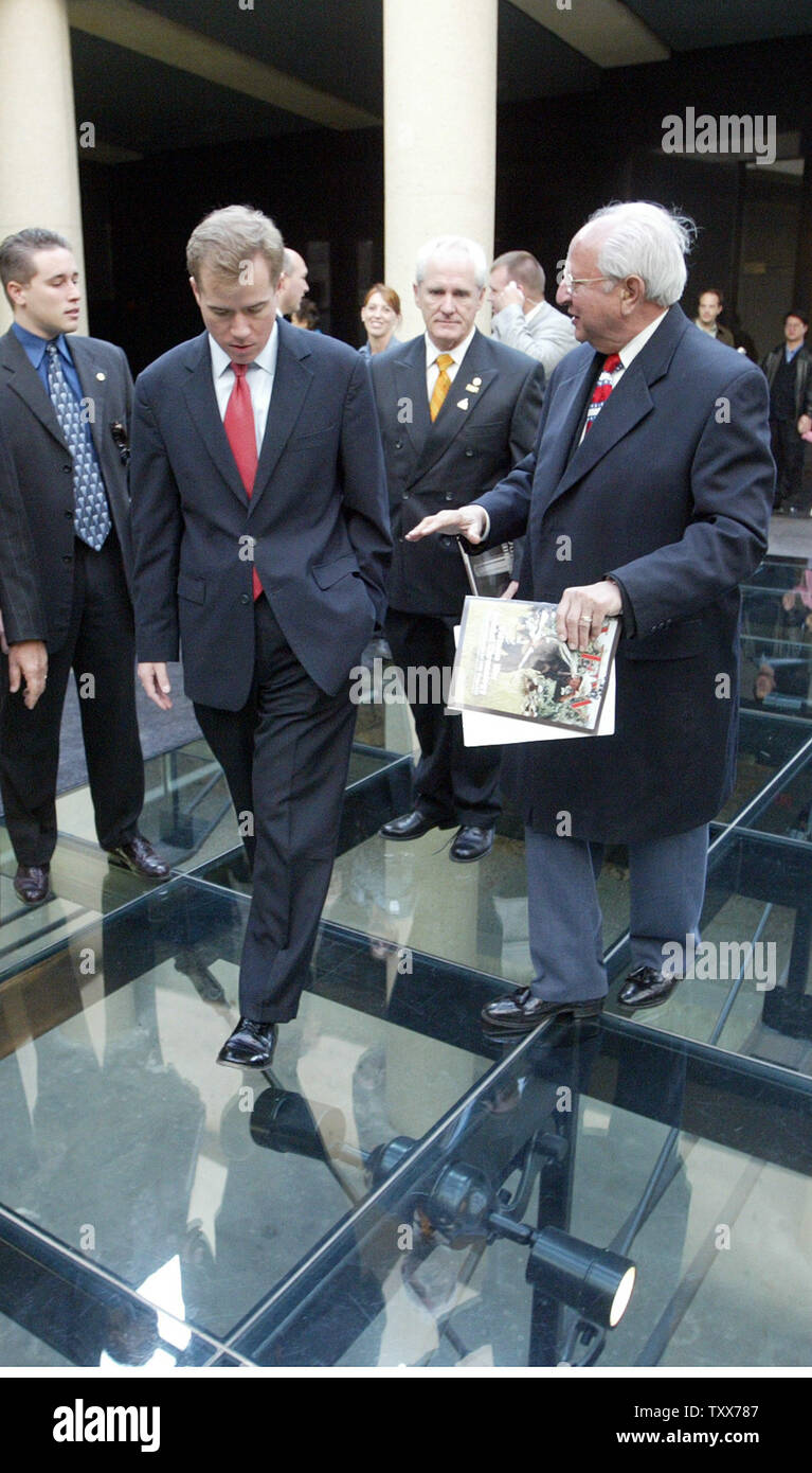 Missouri Governor Matt Blunt (L) checks out the glass floor during a ...