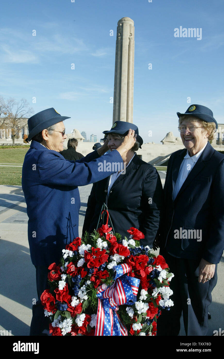 Lala Martin (L) helps Dorthy Ballew with her hat while Magie Cox looks ...