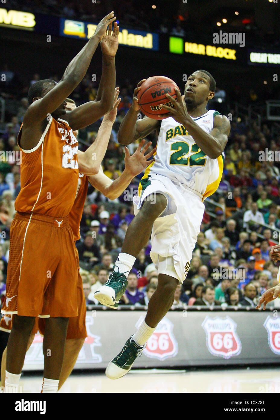 Baylor Bear A.J. Walton attacks the basket while defended by Texas ...