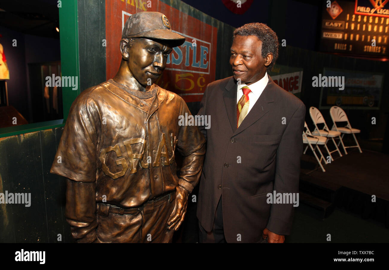 National Baseball Hall of Fame member Lou Brock stands with the bronze ...