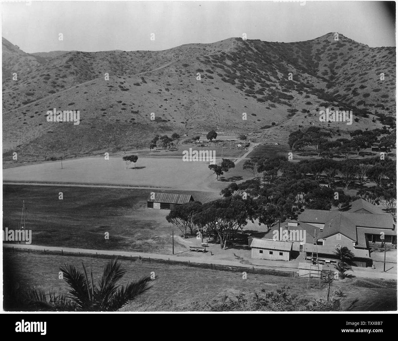 Barracks building in foreground, capacity approximately 250. Full view ...