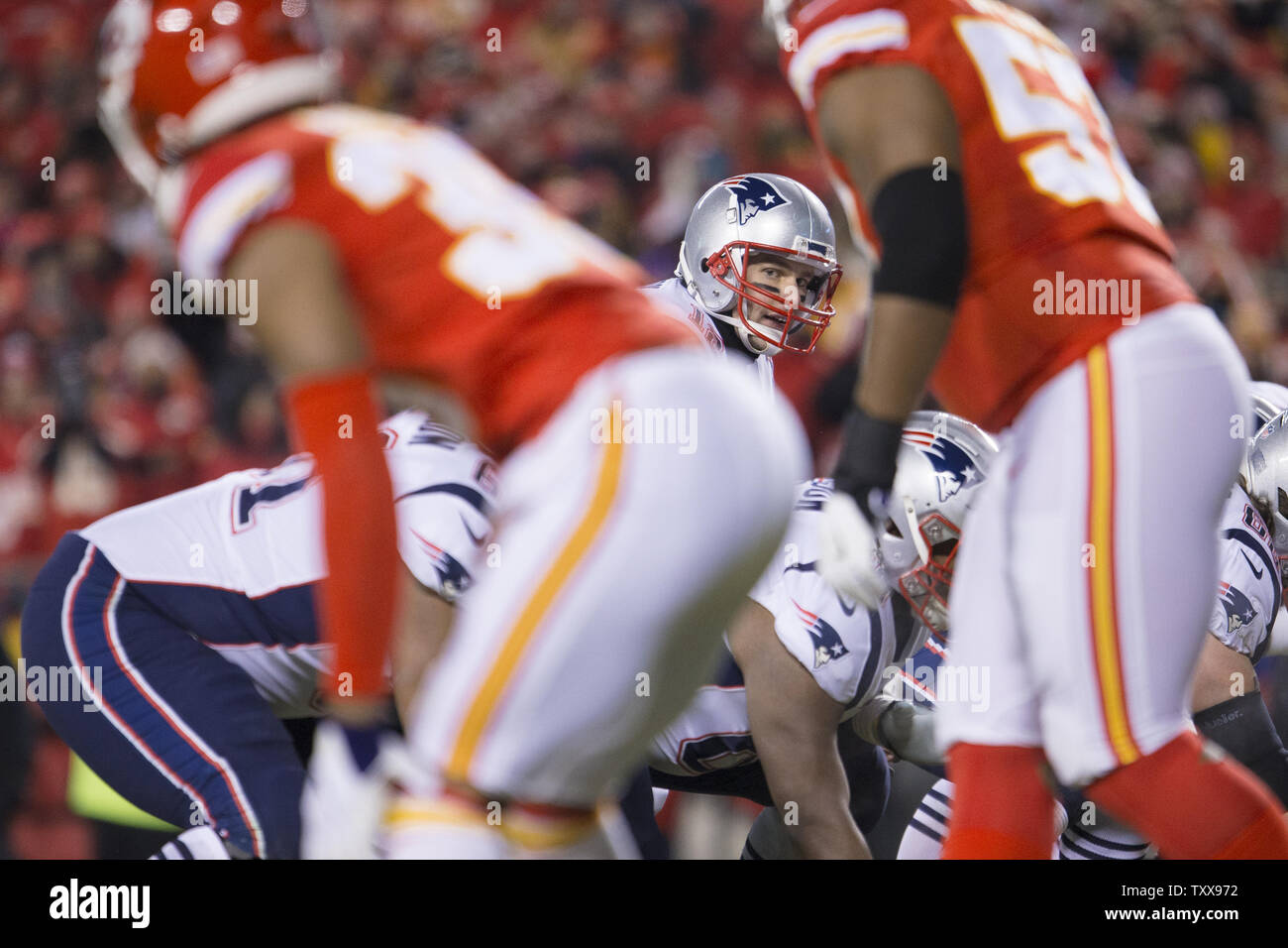 New England Patriots quarterback Tom Brady (12) looks down the Chiefs ...