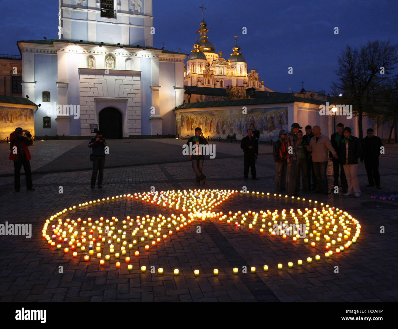 People light candles placed in the form radioactive symbol in Kiev on ...