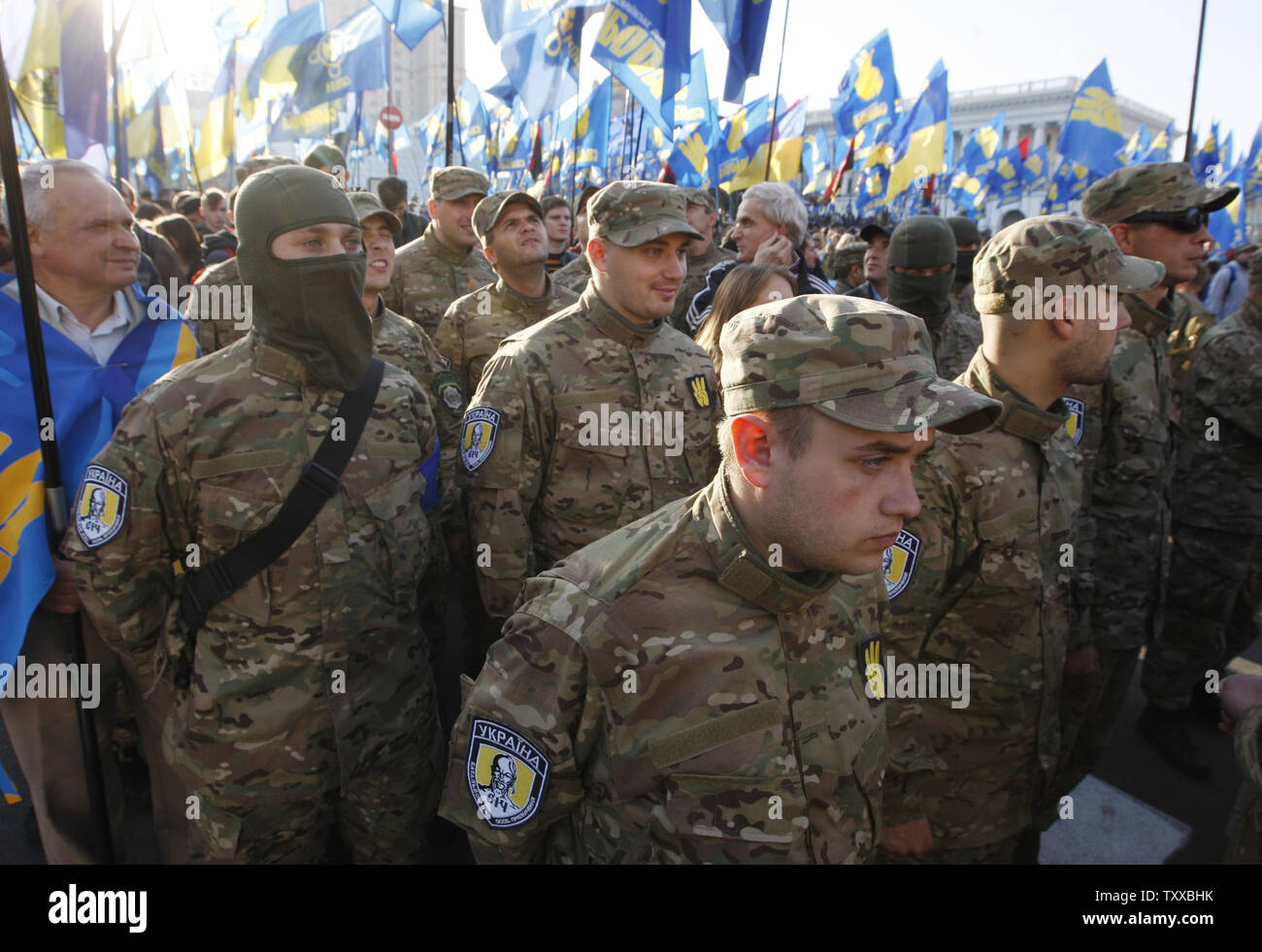 Volunteers from the Azov military battalion rally to mark the ...