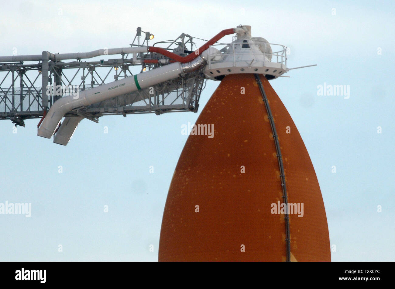 The LOX vent cap is seen covering the cone of the external tank of ...