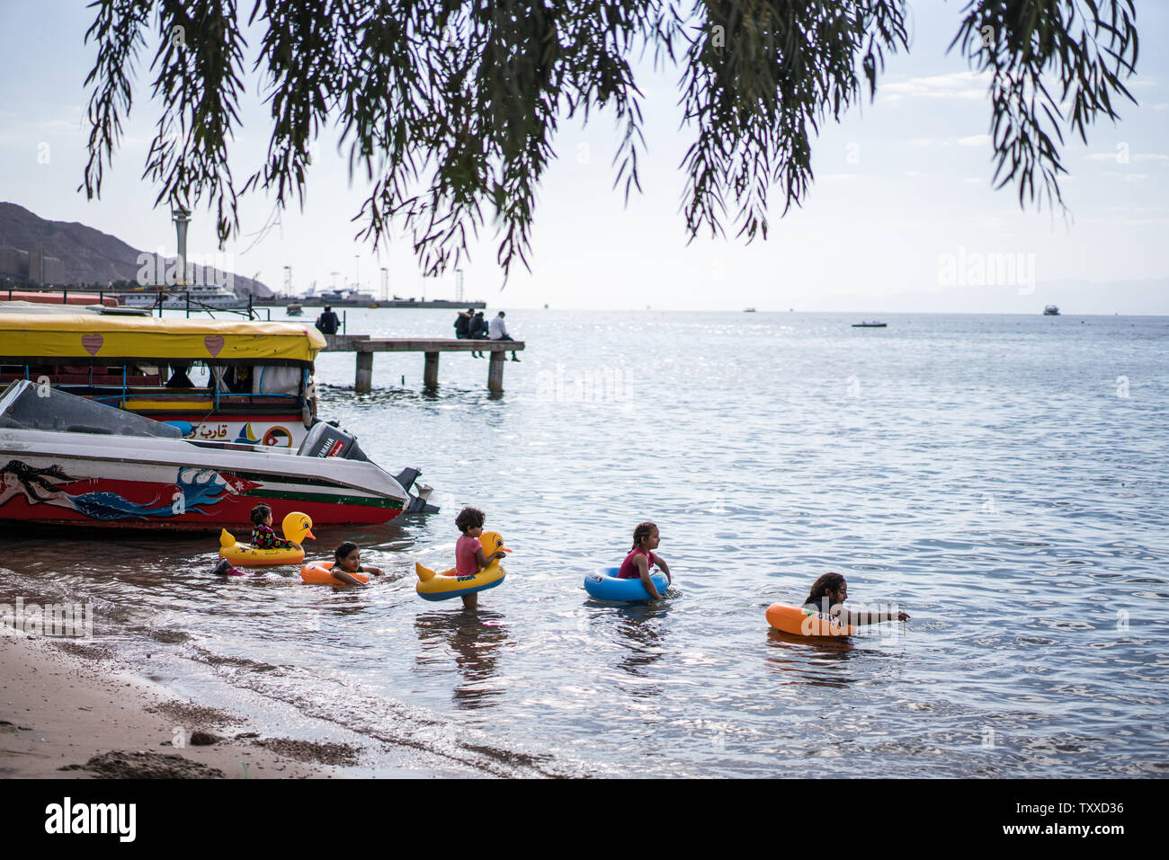 Local people on the beach, Aqaba, Jordan Stock Photo - Alamy
