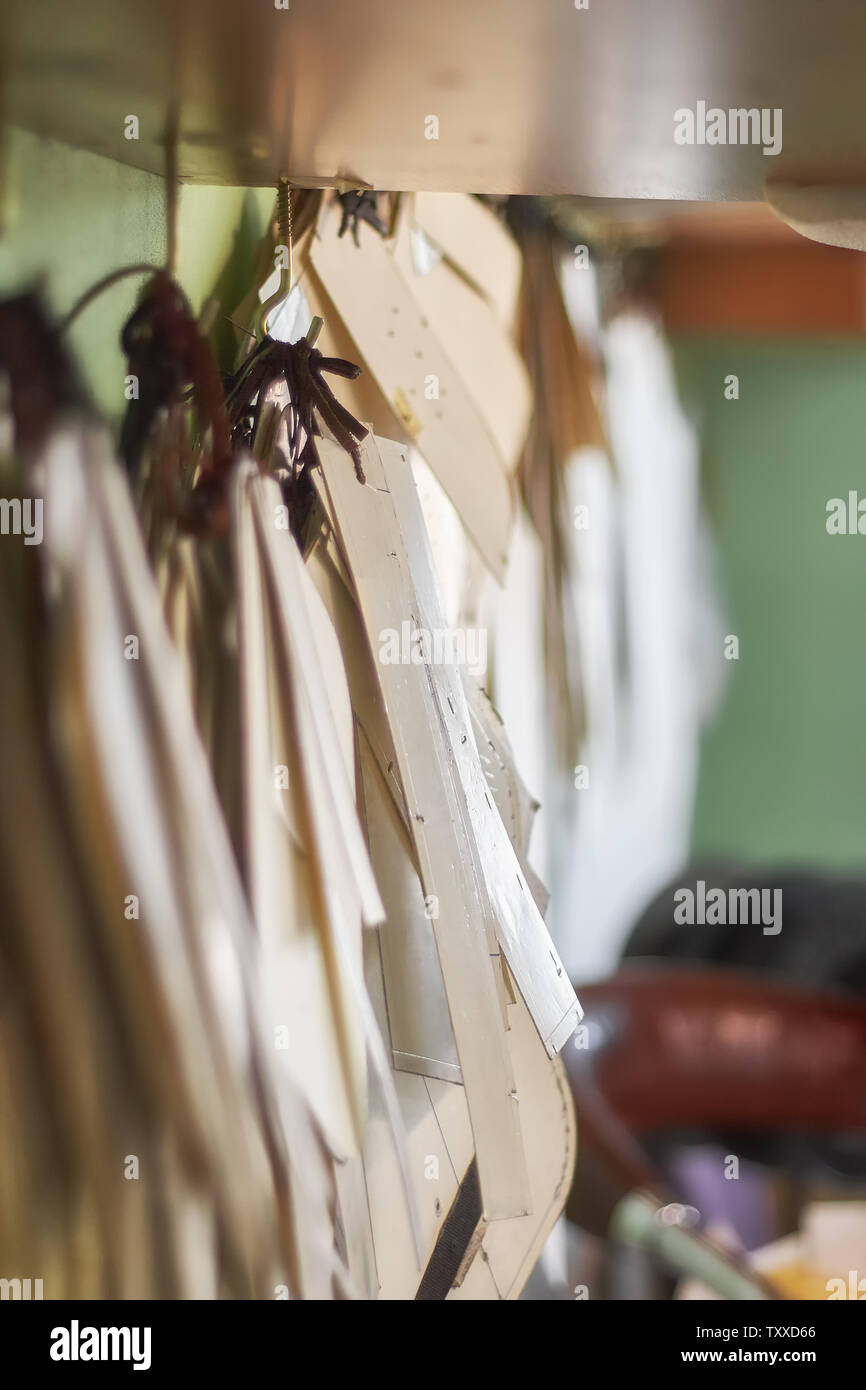 Professional tailor paper template set hanging on the wall in the ...