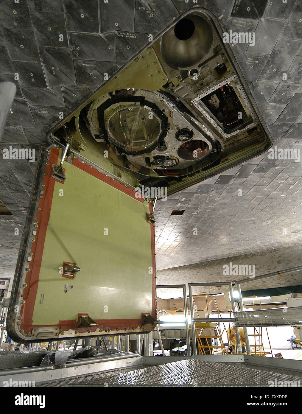 The quick disconnect hatch located on the underside of Space Shuttle ...