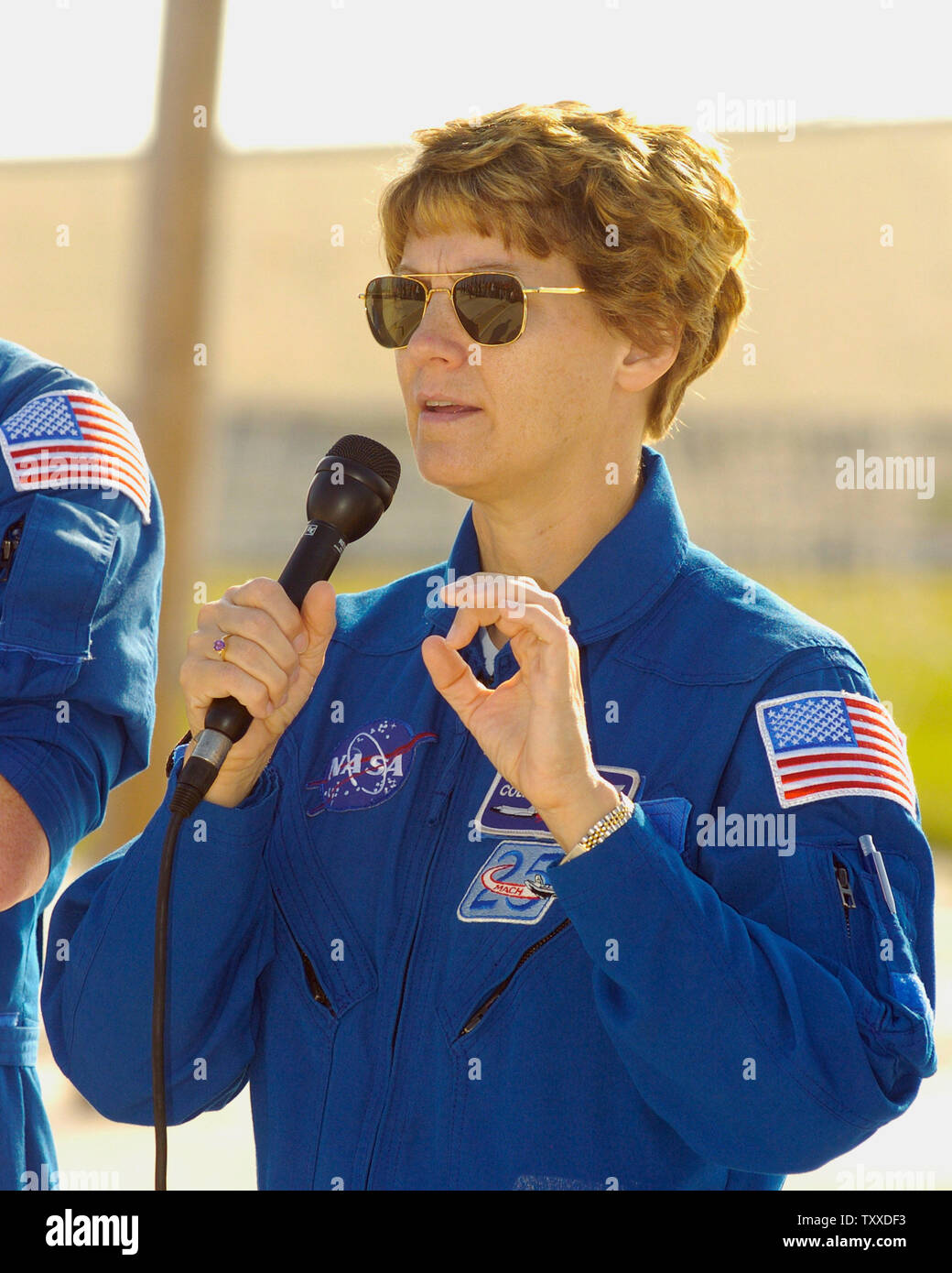 STS 114 Commander, Col. Eileen Collins answers questions at an informal ...