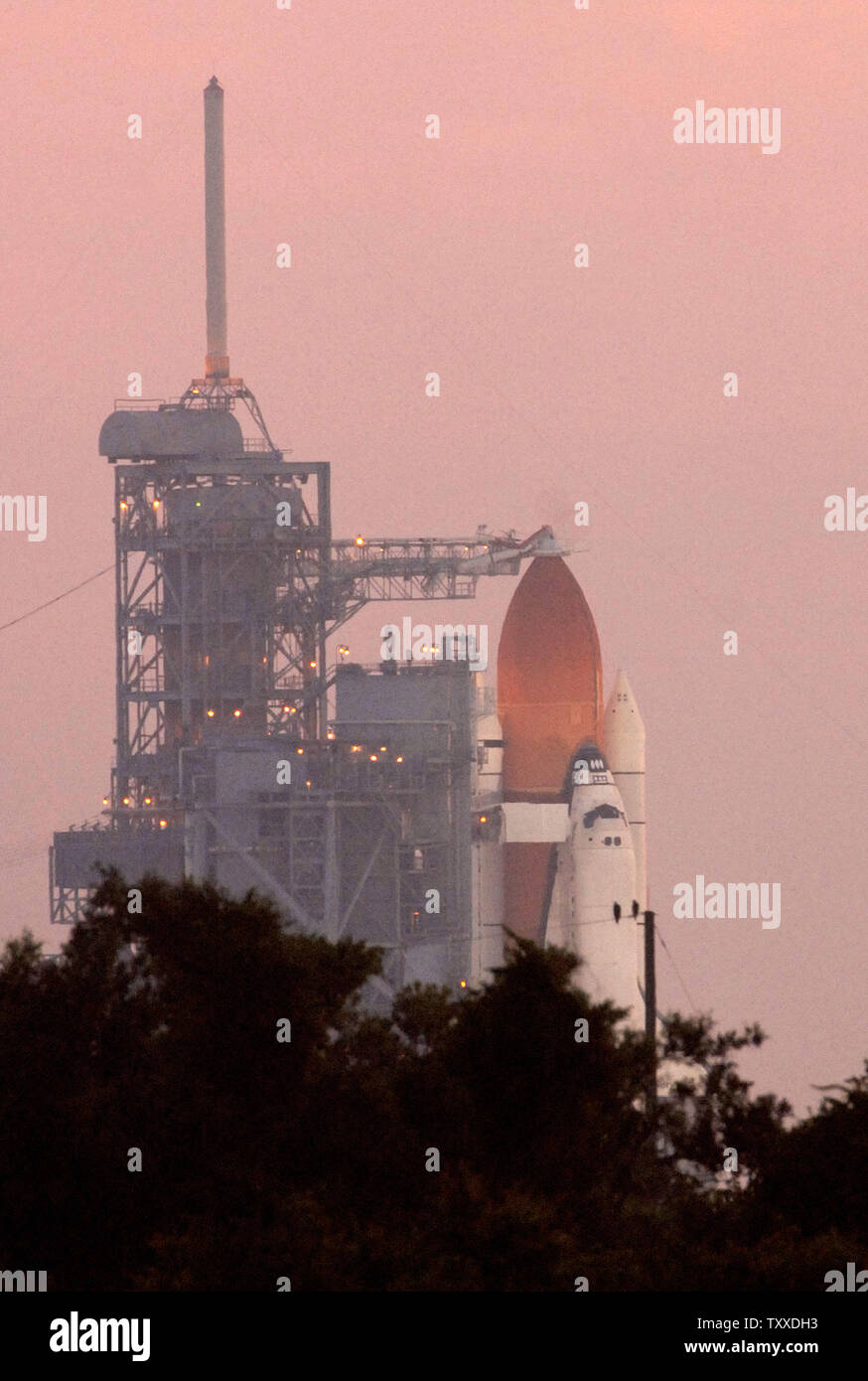 The sun begins to rise at Kennedy Space Center in Florida on July 13 ...