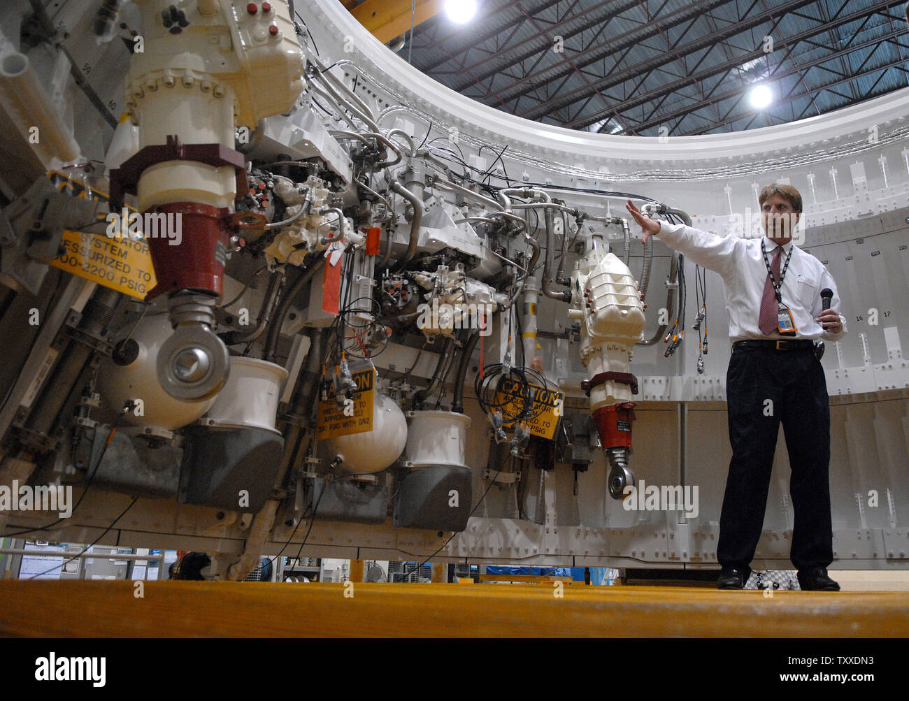 C.J. Smith, of NASA avionics, speaks alongside the internal section of ...
