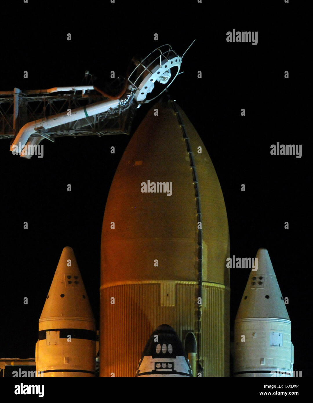 The nose cones of NASA's Space Shuttle Atlantis and its fuel tanks are ...