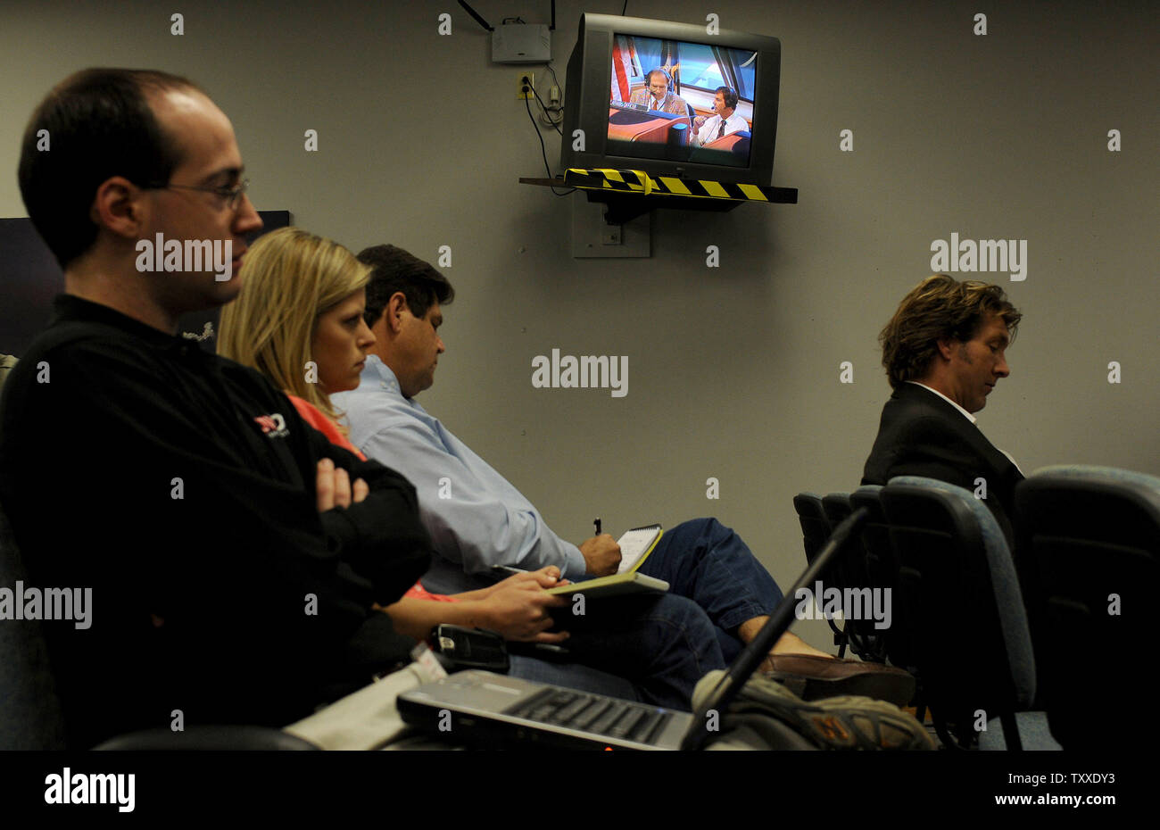 Journalist sit in as NASA's Public Affairs officer George Diller and ...
