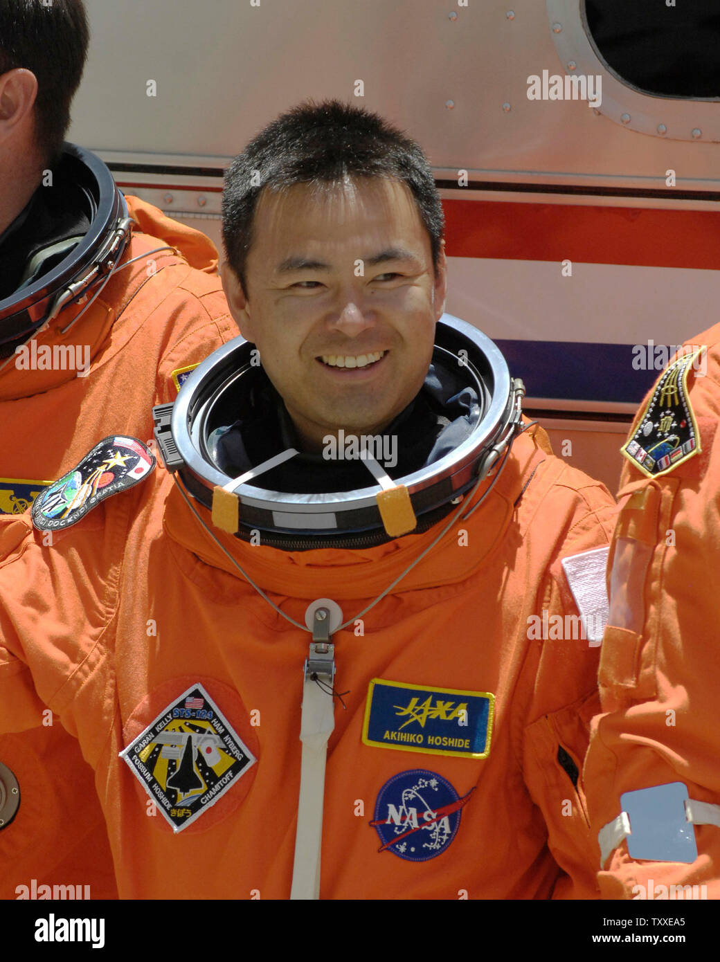 Astronaut and Mission Specialist Akihiki Hoshide departs from the crew ...