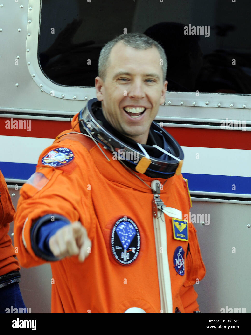 STS 125 Mission Specialist 5, Andrew Feustel poses for media prior to ...