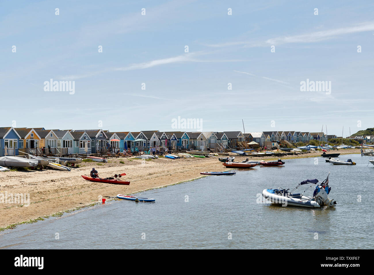 The colourful and highly sought after beach huts on Mudeford Spit ...