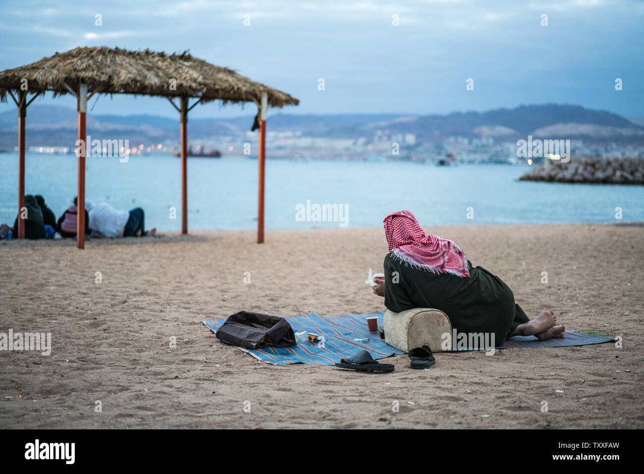 Local people on the beach, Aqaba, Jordan Stock Photo - Alamy