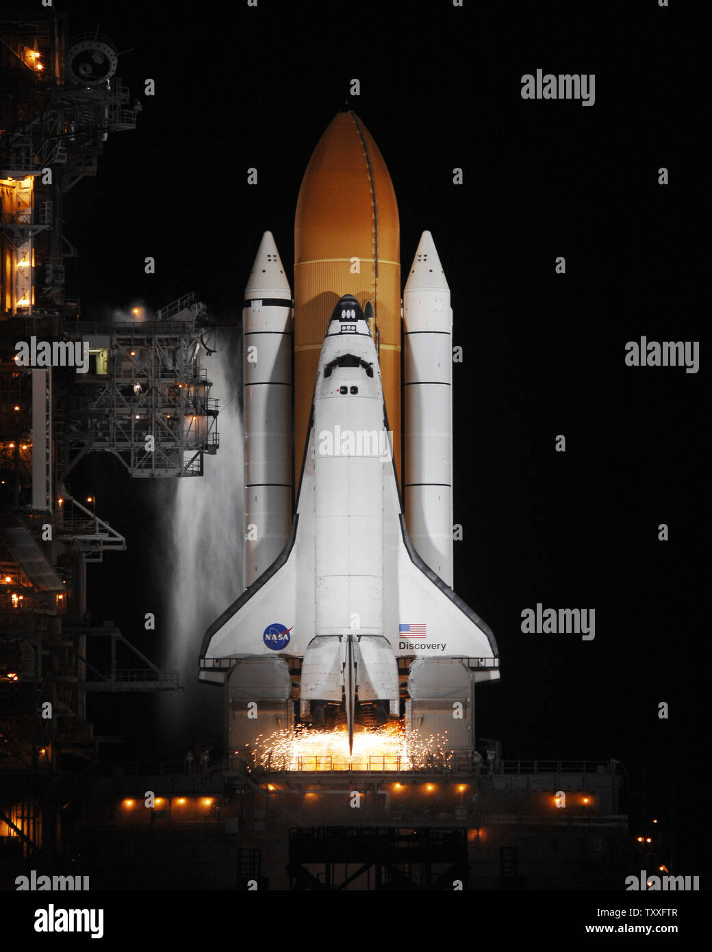 Spark igniters erupt under NASA's space shuttle "Discovery" moments ...