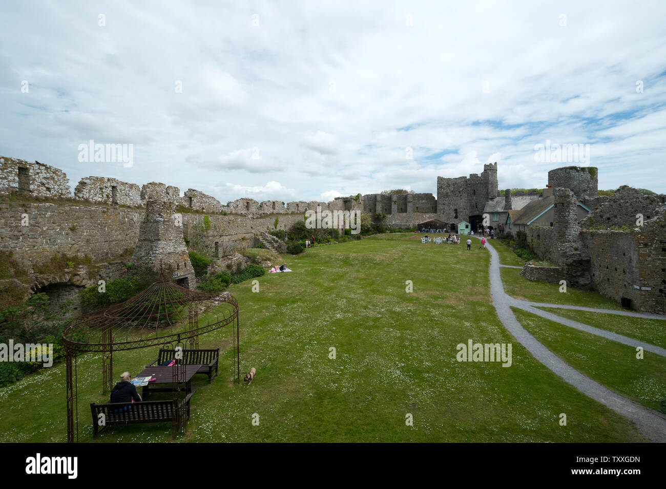 Manorbier Castle and Monarbier Bay with coast path, Pembrokeshire ...