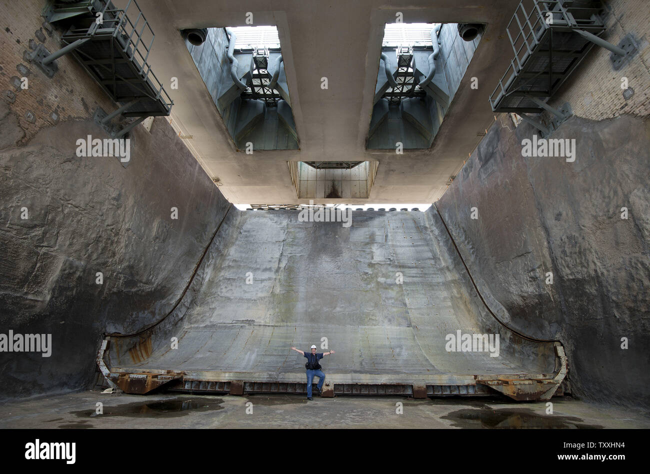 To show a sense of scale, a photographer sits at the base of the flame ...
