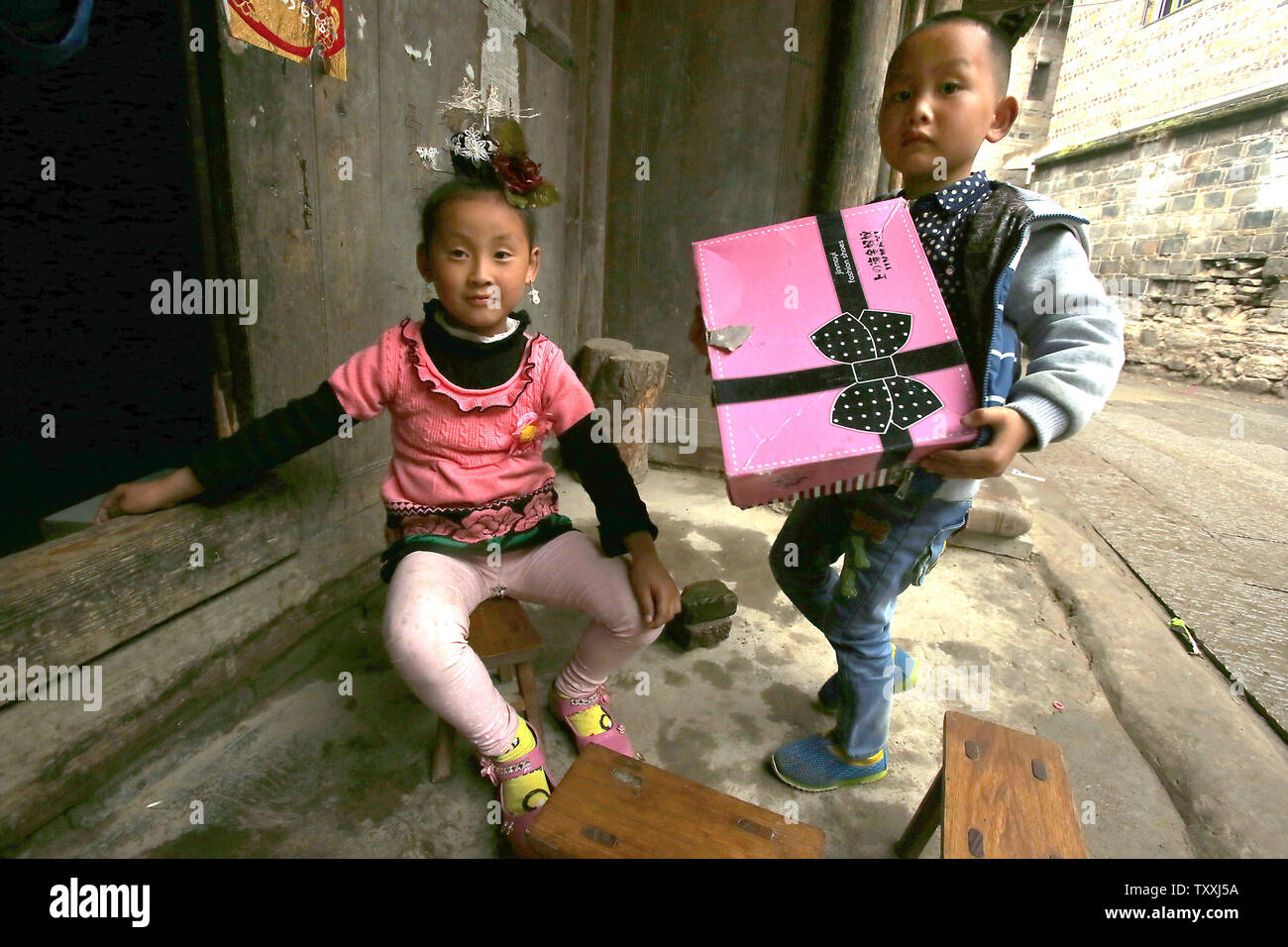 Miao children play as Miao women and men take part in the annual Sister ...