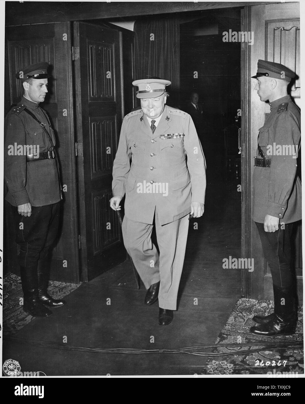 British Prime Minister Winston Churchill leaving the conference room ...