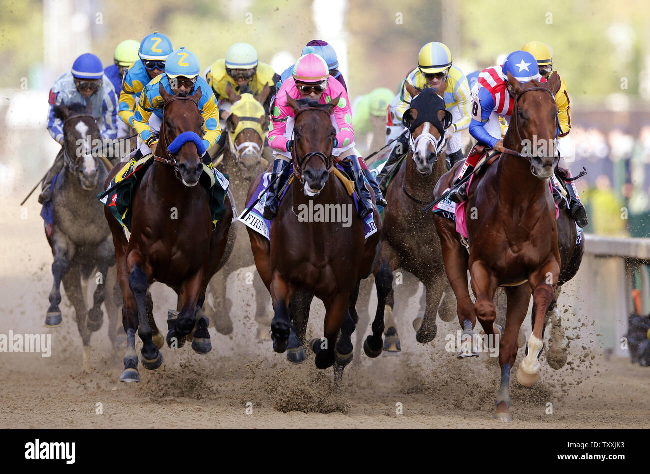 Horses run down the front stretch in the 141st running of the Kentucky ...