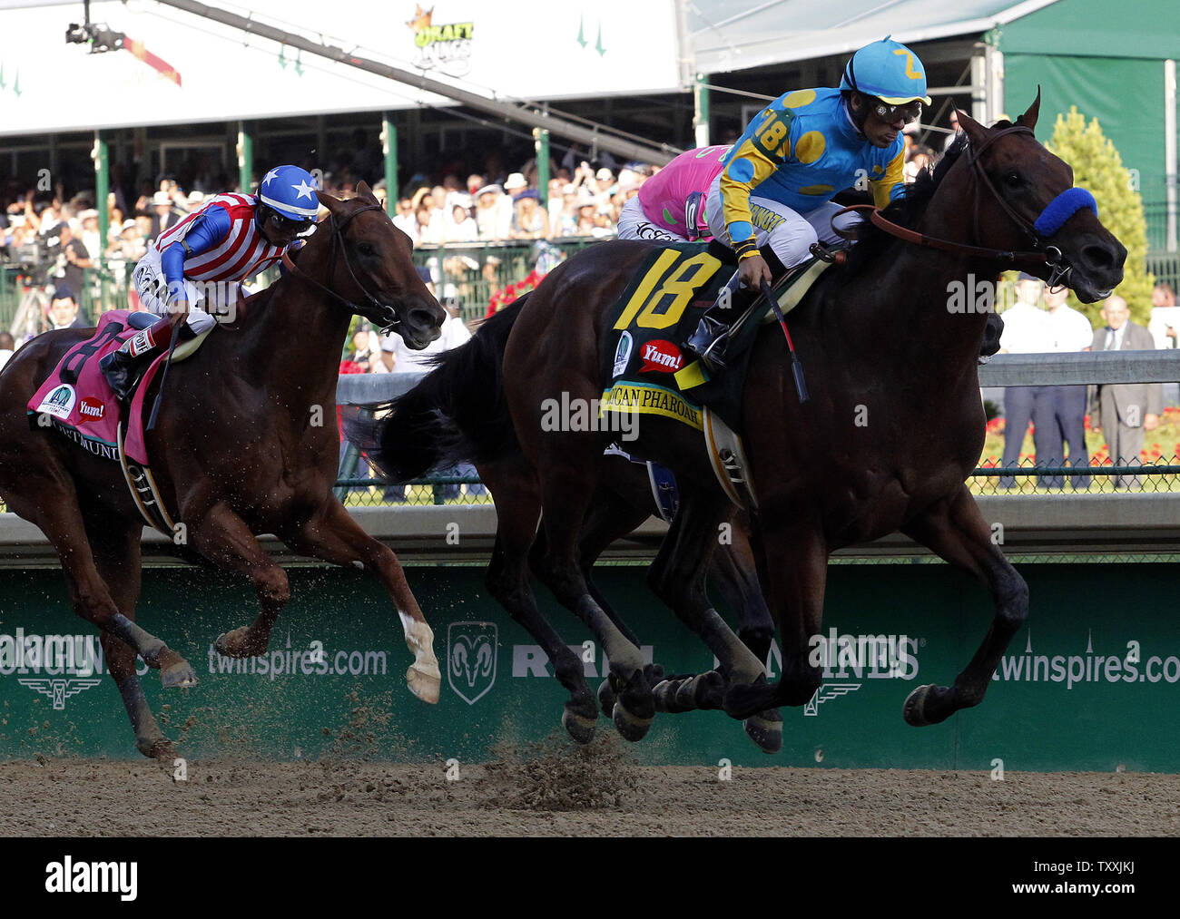 American Pharaoh, with Victor Espinoza up (R), leads Firing Line (C ...