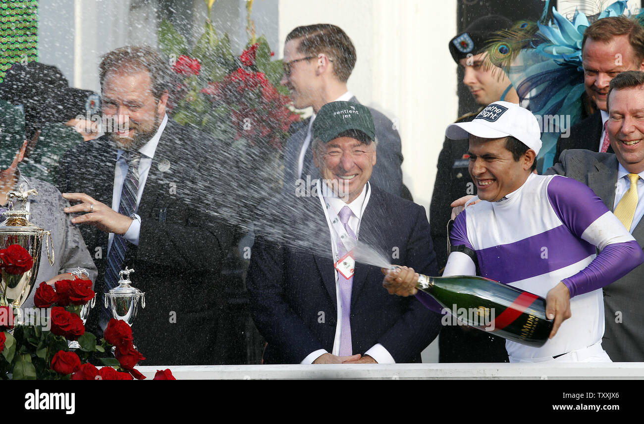 XX XX, aboard XXX, celebrates after winning the 142nd running of the ...