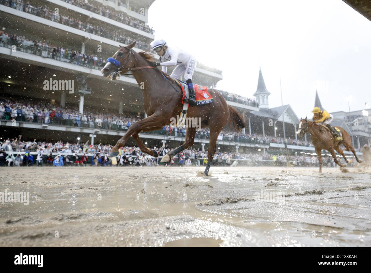 Jockey Mike Smith aboard Justify crosses the finish line to win the ...