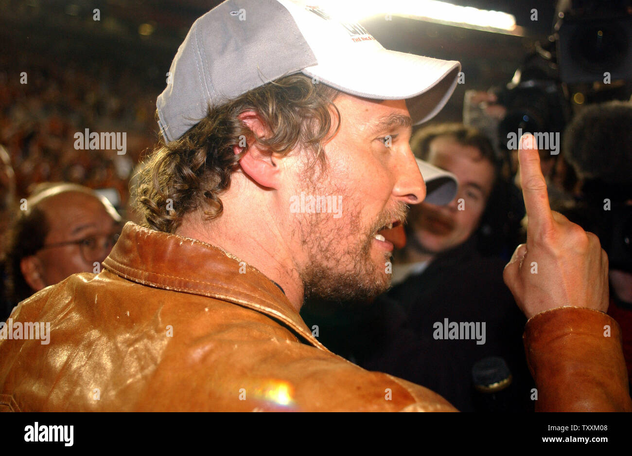 Actor Matthew McConauguey holds up a finger after the University of ...
