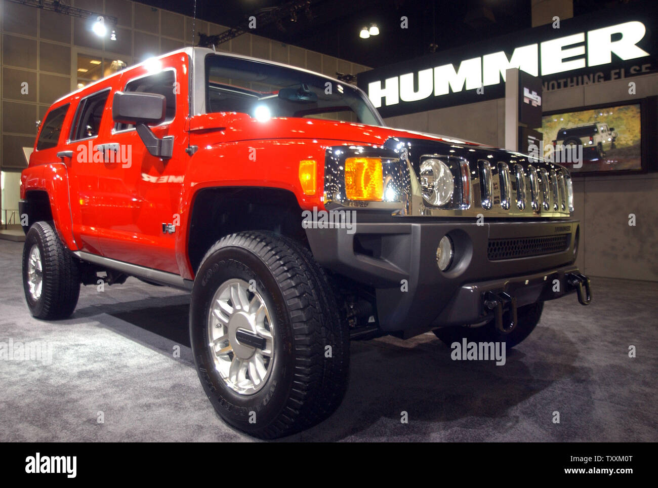 Lifted Red Hummer H3