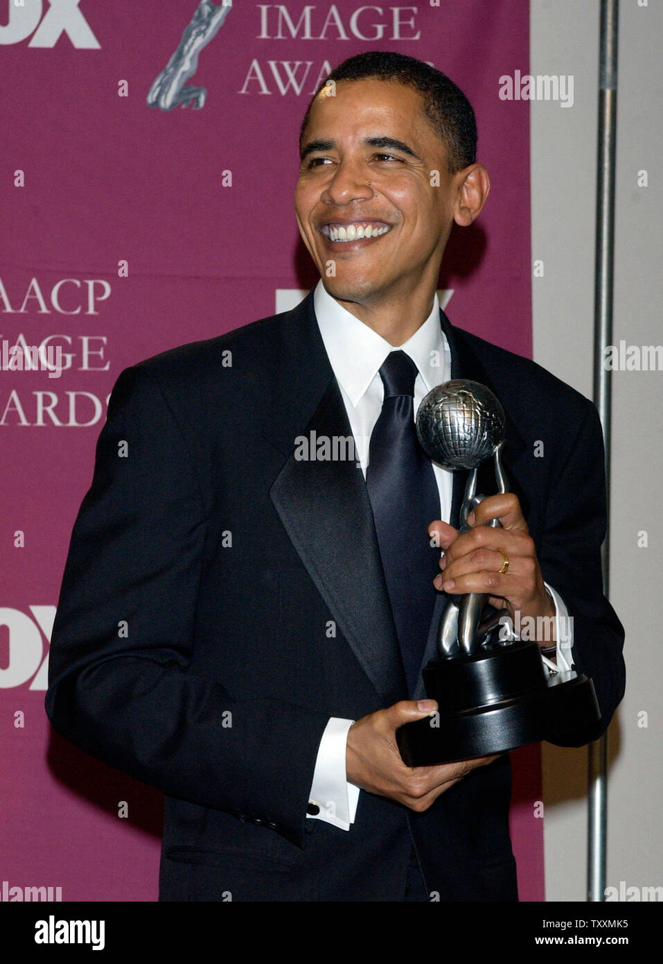 United States Senator Barack Obama (D-Illinois) holds his award ...