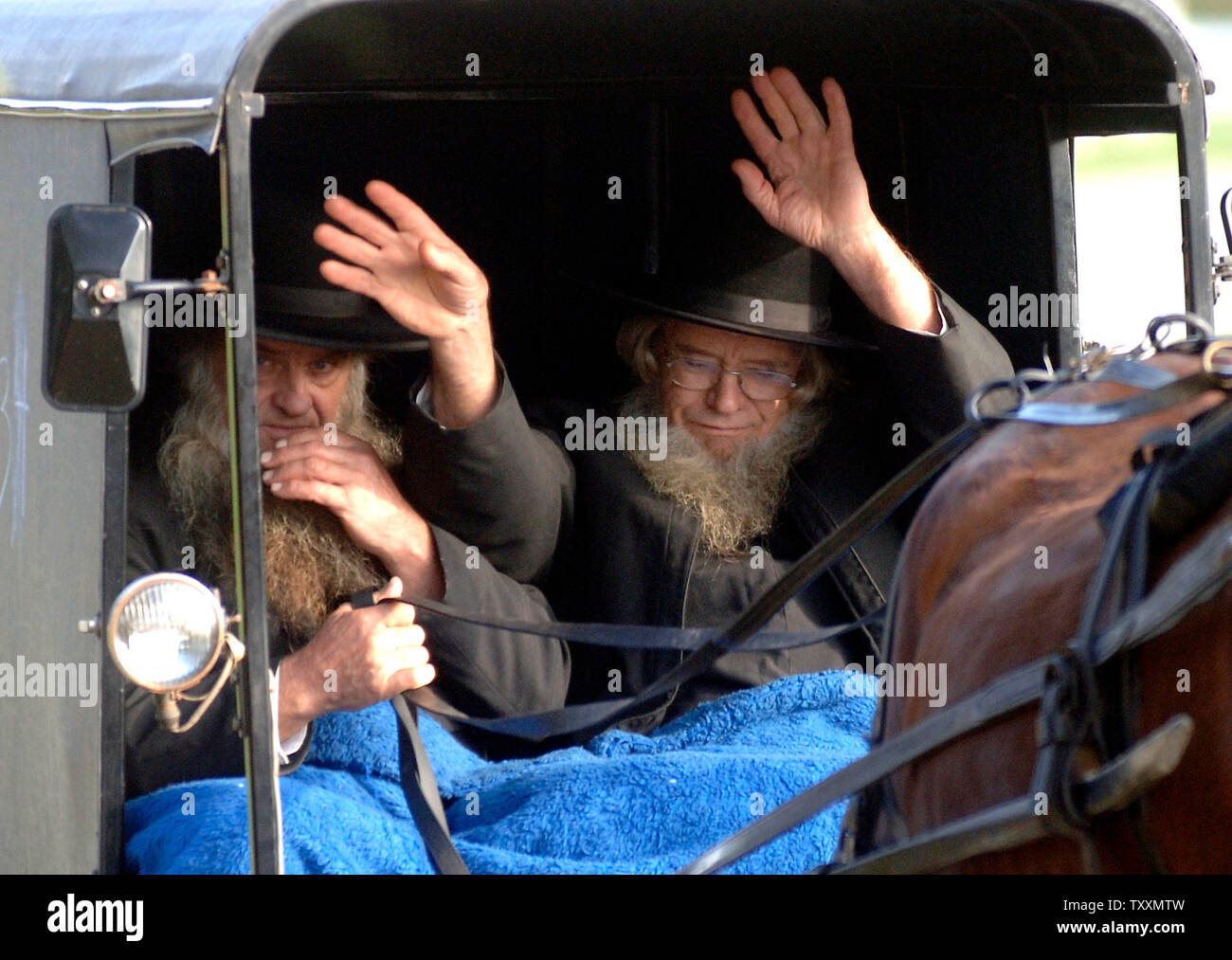 Two Amish elders ride in the funeral procession for sisters Mary Liz ...