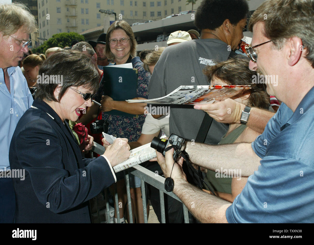 Actress Cindy Williams, left, signs autographs for fans after her ...