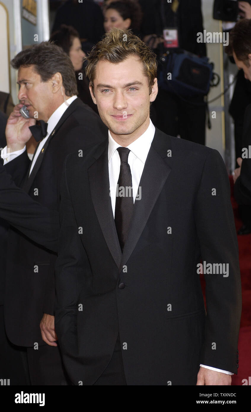 Actor Jude Law poses for photographers, during the 61st annual Golden ...