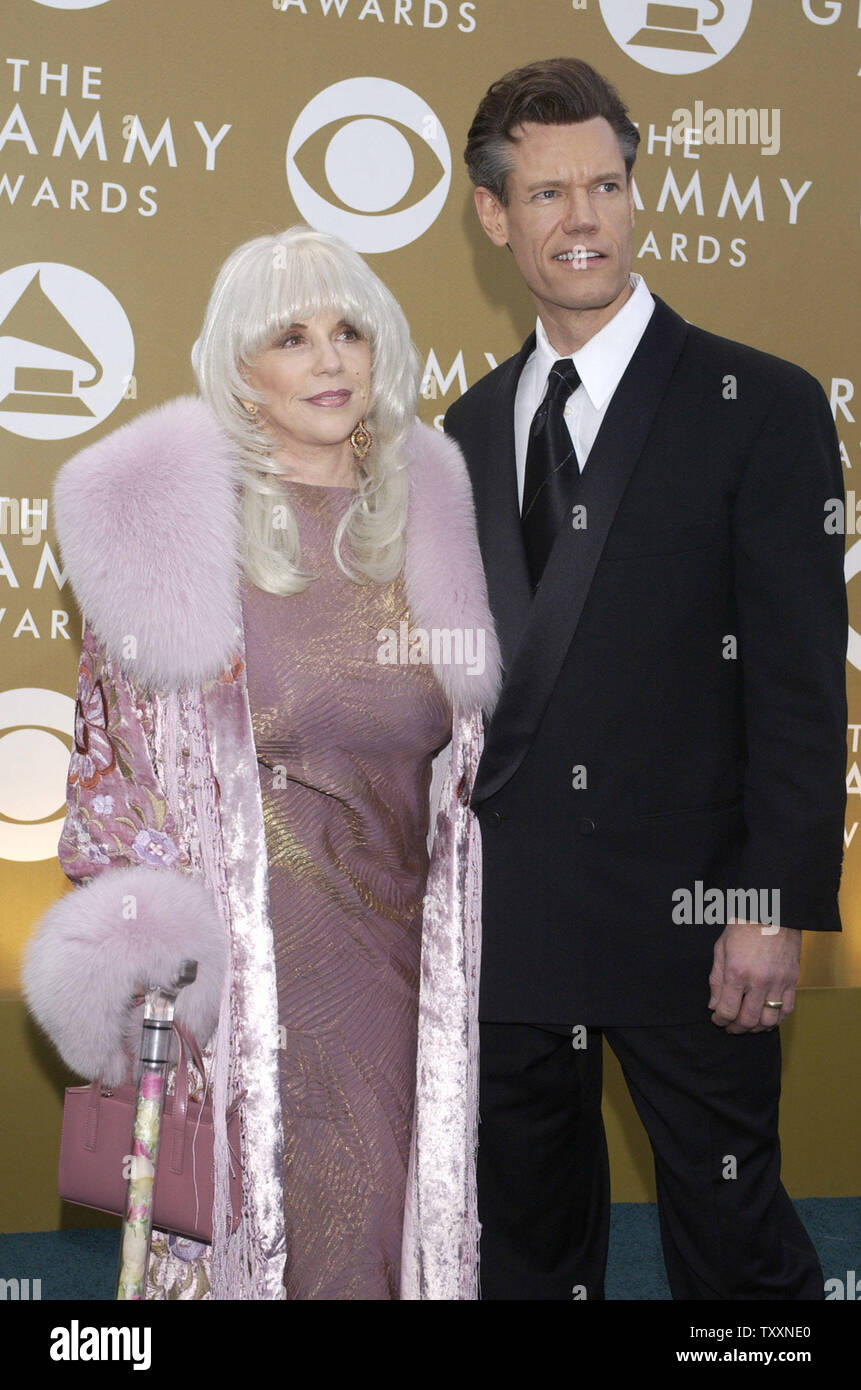 Country singer Randy Travis and his wife Kimberly Elizabeth pose for ...