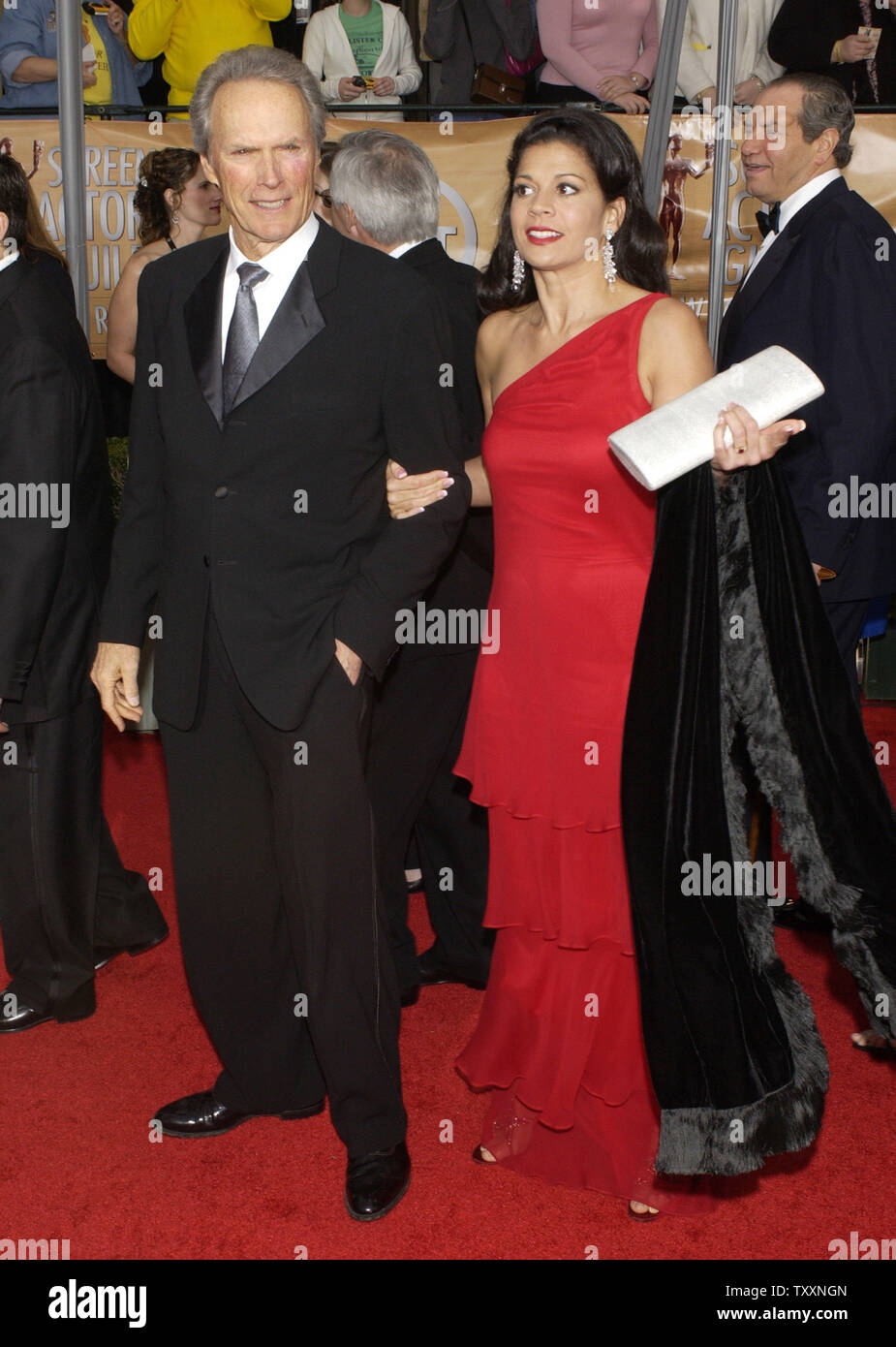 Actor and director Clint Eastwood and his wife Dina pose as they arrive ...