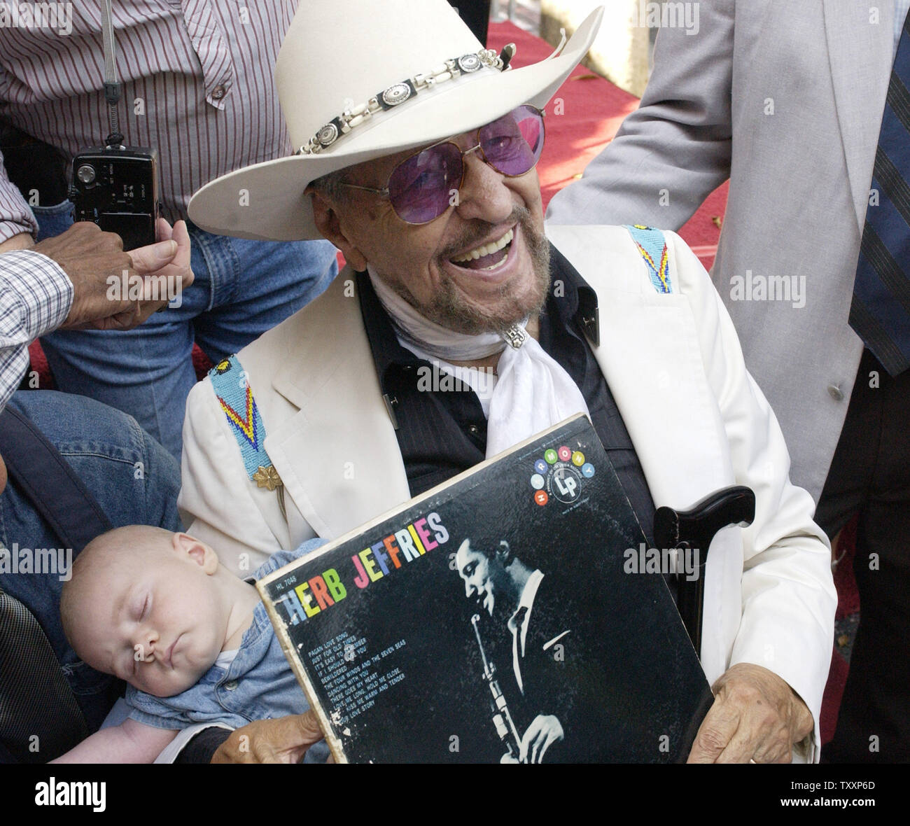 Herb Jeffries, a singing cowboy hero of the silver screen, holds his 4 ...