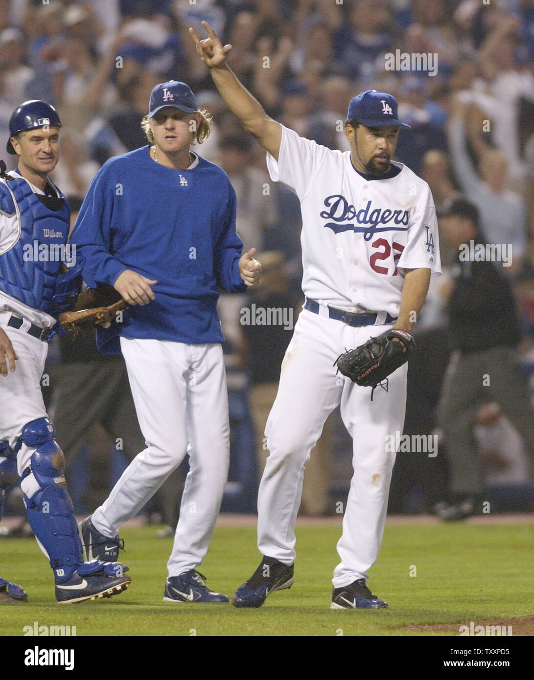 Los Angeles Dodgers pitcher Jose Lima (R) celebrates the last out of ...