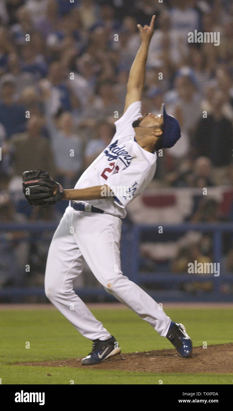 Los Angeles Dodgers pitcher Jose Lima points to a pop up for the last ...