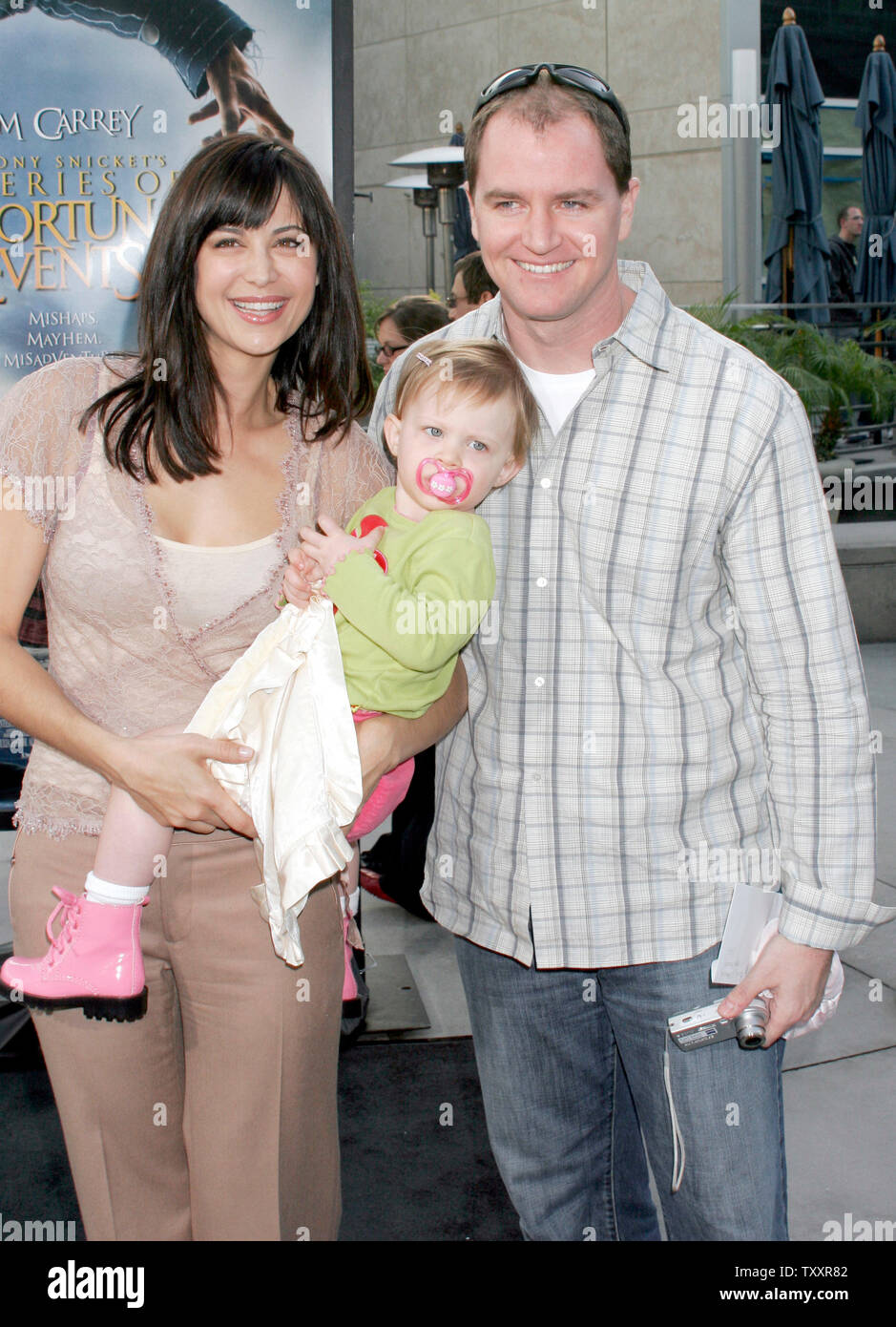 Actress Catherine Bell, left, her husband, Adam Beason, and daughter ...