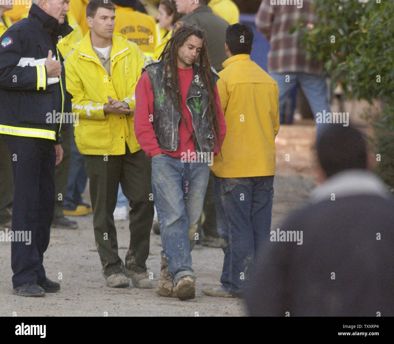 Jimmie Wallet (with vest) walks among rescue workers January 11, 2005 ...