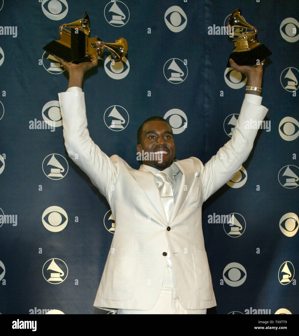 Kanye West holds with his three awards backstage at the 47th annual ...