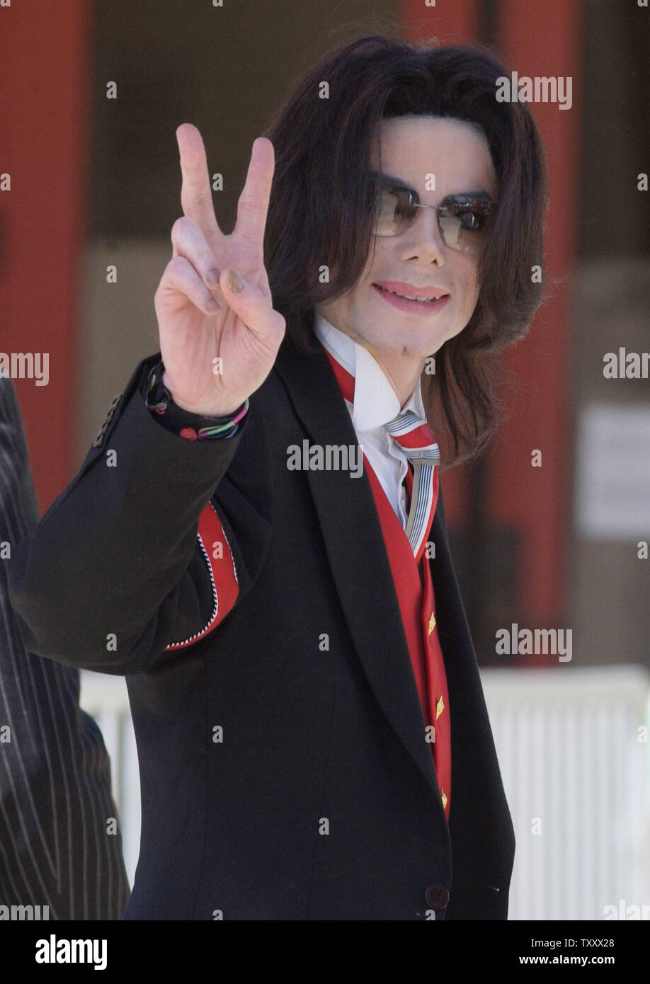 Michael Jackson gestures to his fans as he arrives at the Santa Barbara ...