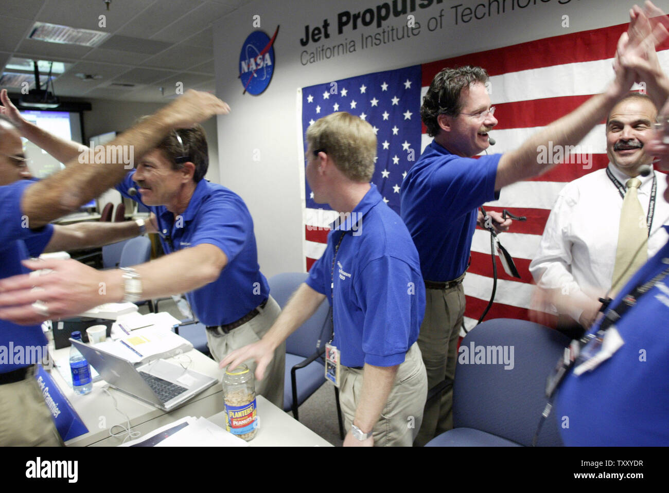 NASA engineers react to the successful collision of the impactor probe ...